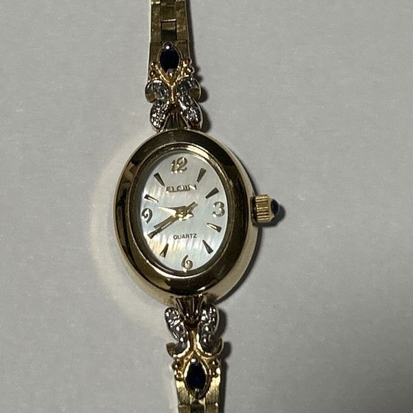 Vintage Elgin Womenâ s Gold Tone With Ruby Stone Watch | WatchCharts ...