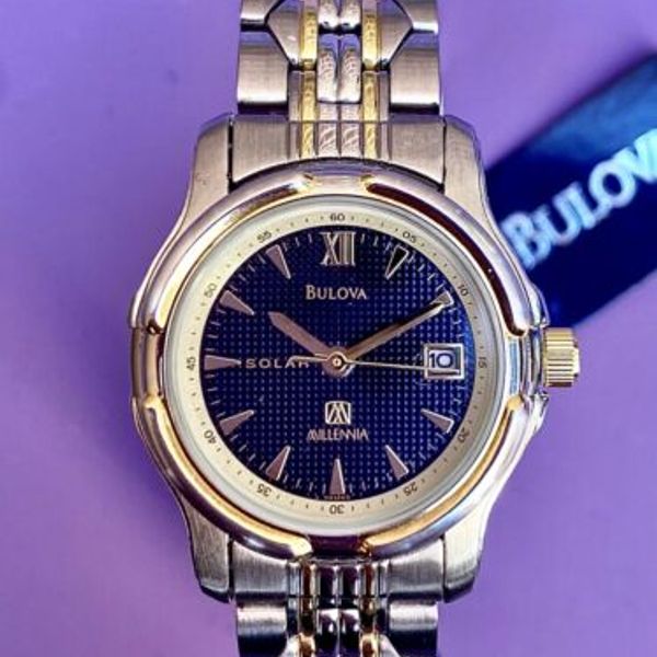 Bulova Men's Millennia Solar Two-Tone Blue Dial Date Indicator Watch ...