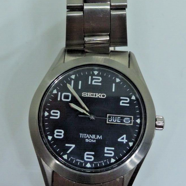 Seiko Titanium Men's Day Date Quartz Watch Black Dial 7N43-0AB0 ...