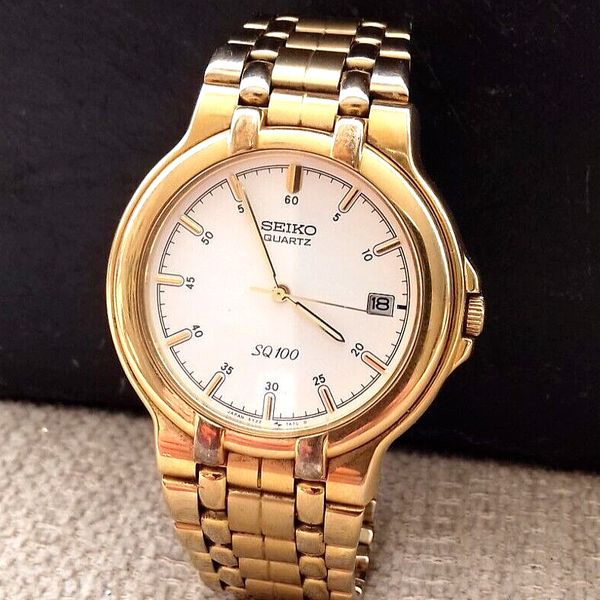 Seiko SQ100 gold plated mens watch | WatchCharts Marketplace