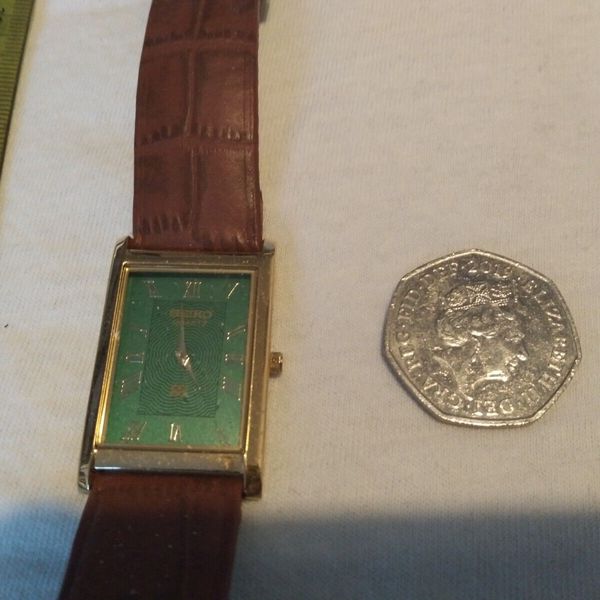 gents seiko watch used rectangular face .green dial ,gold coloured case ...