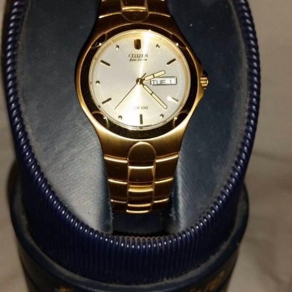 Gold Citizen Eco-Drive, model E100-K17551 CKW. English/Spanish. Never ...