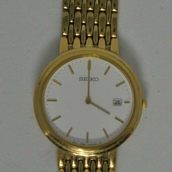 SEIKO Gold Tone Quartz Watch Model V739-0A59 | WatchCharts Marketplace