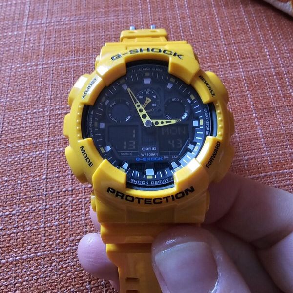 Casio G Shock GA-100A Yellow Analog & Digital Watch With Metal Tin ...