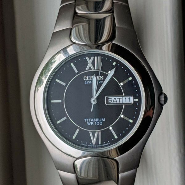Citizen Men's Eco-Drive E100-K18434 Titanium WR-100 Watch With Day Date ...
