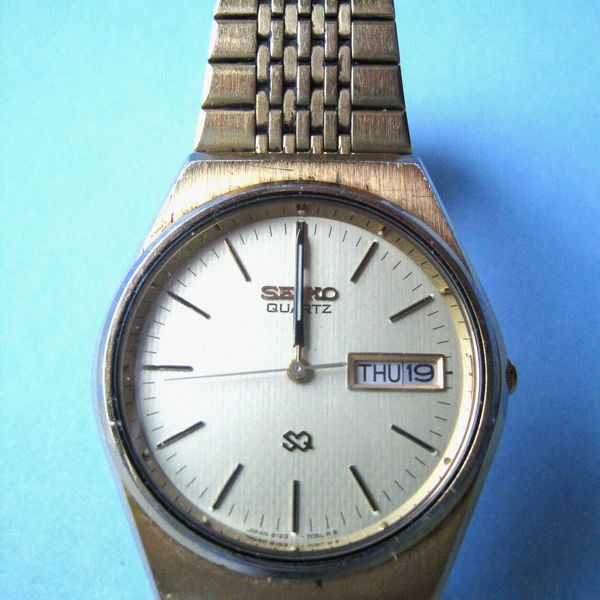 Vintage SEIKO Quartz SQ Day Date 8123-7049 Gold Patina Menâ s Watch | WatchCharts Marketplace