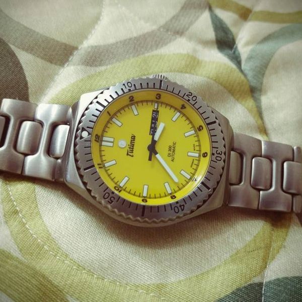 Tutima DI300 yellow dial 500usd | WatchCharts