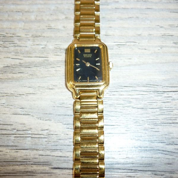 VINTAGE SEIKO QUARTZ WATCH BLACK DIAL GOLD-TONE WOMENS PETITE | WatchCharts Marketplace