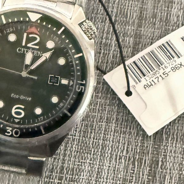 Citizen Echo-Drive Green Dial Offset Crown Green & Black Bezel Date AW1715-86X | WatchCharts ...