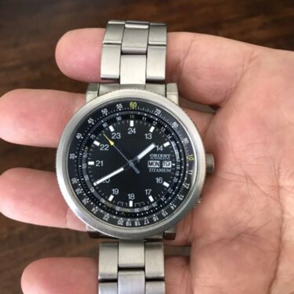 Orient EM58-C0 Titanium Day Date Automatic Slide Rule Japan Automatic Mens Watch | WatchCharts ...