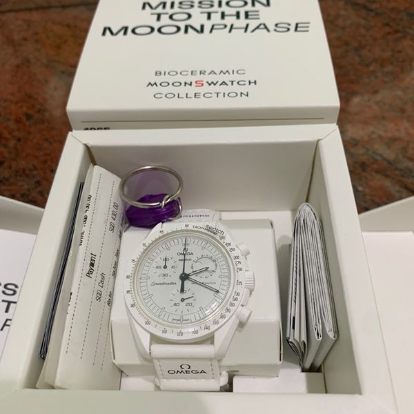 Swatch moon phase white snoopy | WatchCharts Marketplace