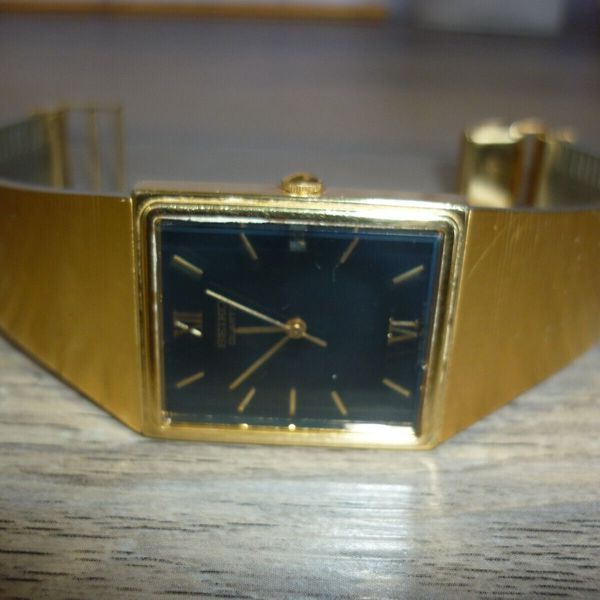 VINTAGE SEIKO QUARTZ WATCH DATE BLACK DIAL GOLD TONE MENS | WatchCharts Marketplace