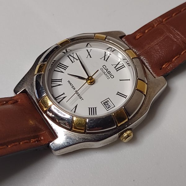 Two Tone Casio Quartz Analog Roman Numeral Watch | WatchCharts Marketplace