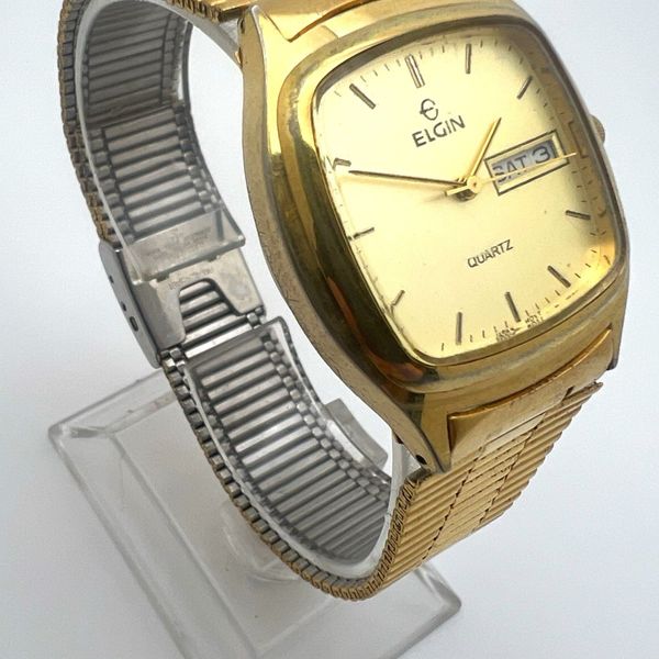 Elgin Men's Gold Toned tank style day/date quartz | WatchCharts Marketplace