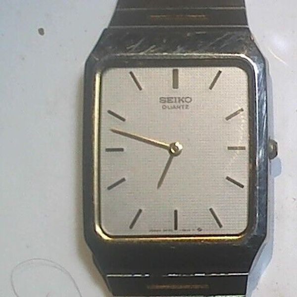 Seiko ultra-thin rectangular dress watch with silver-tone dial and gold ...