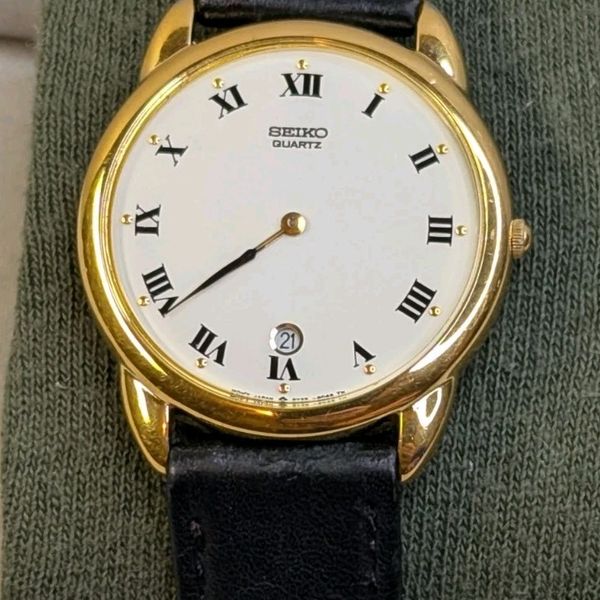 Vintage Seiko Gold Tone Men's Quartz Watch with Date and Leather Strap ...