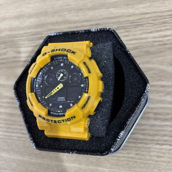 Casio G-Shock GA-100A Yellow Digital Analogue Men's Watch | WatchCharts ...