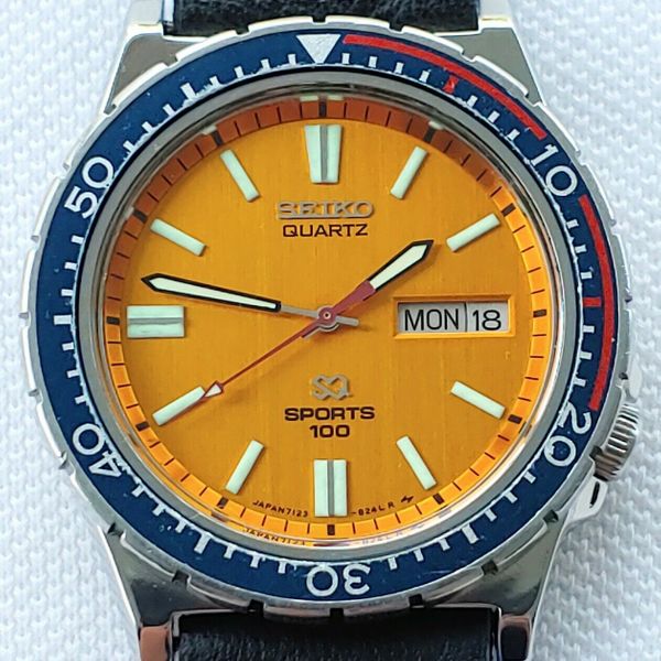 Superb original vintage Seiko SQ 7123-823H Sports 100 Orange dial watch ...