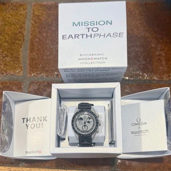 Swatch x Omega Mission to the EarthPhase - Bioceramic MoonSwatch ...