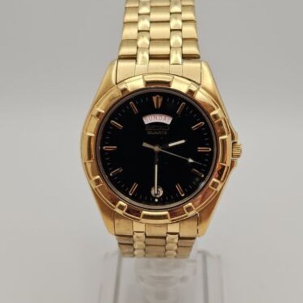 Vintage Seiko 7N43-6A79 Gold Tone Date/Day Quartz Watch - Working | WatchCharts Marketplace