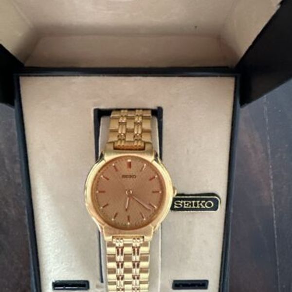 Seiko Stainless All Gold Tone Mens Watch 50M Japan Quartz Movement V701 | WatchCharts Marketplace