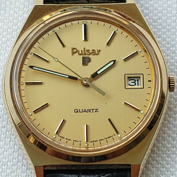 Pulsar V562-8159 Gold Dial Date Quartz Feb 1983 | WatchCharts Marketplace