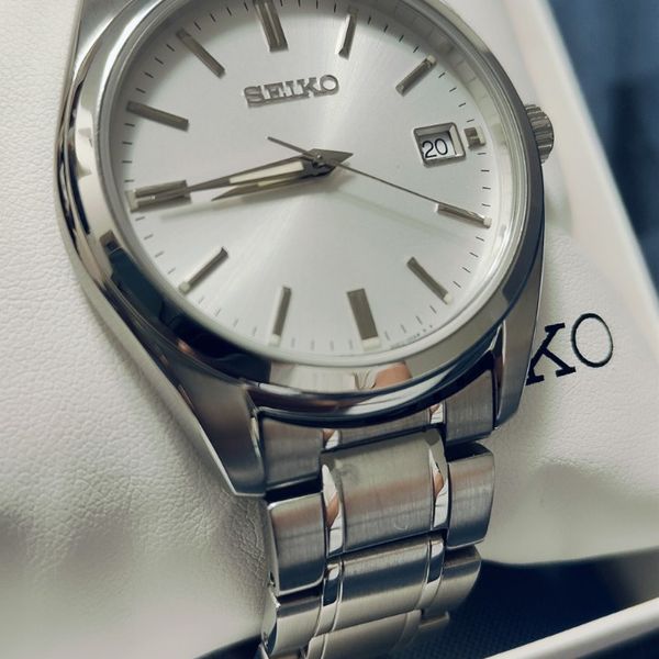 Seiko Men's Essentials 42mm Quartz Silver Dial Watch Model SUR307 | WatchCharts Marketplace