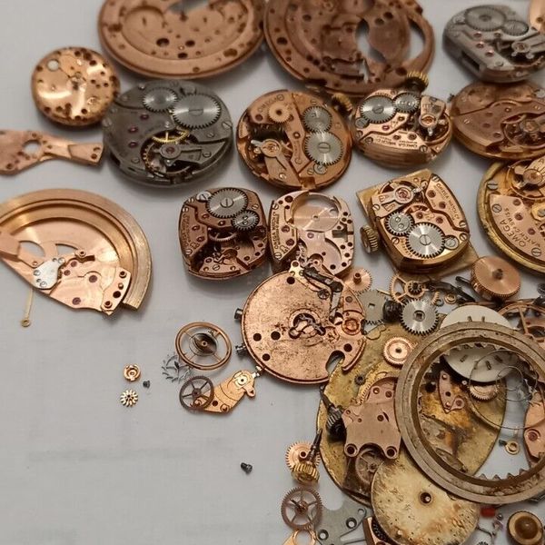 Omega watch spares large collection movements dials cogs ect ...