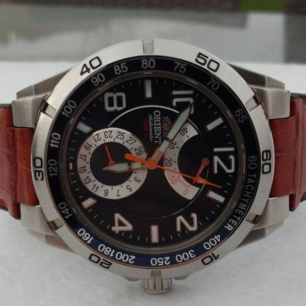 Orient - Planet Orient - Blue dial with orange accents - $150 | WatchCharts
