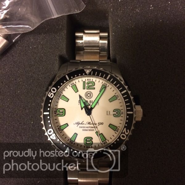 Deep blue Swiss made alpha marine automatic lume dial | WatchCharts ...