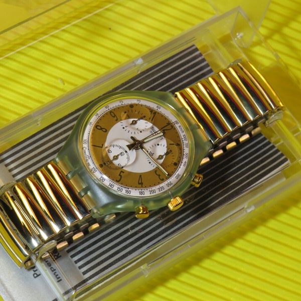 Swatch Chrono GOLDEN GLOBE - SCG100/101 - NEU & OVP . | WatchCharts ...