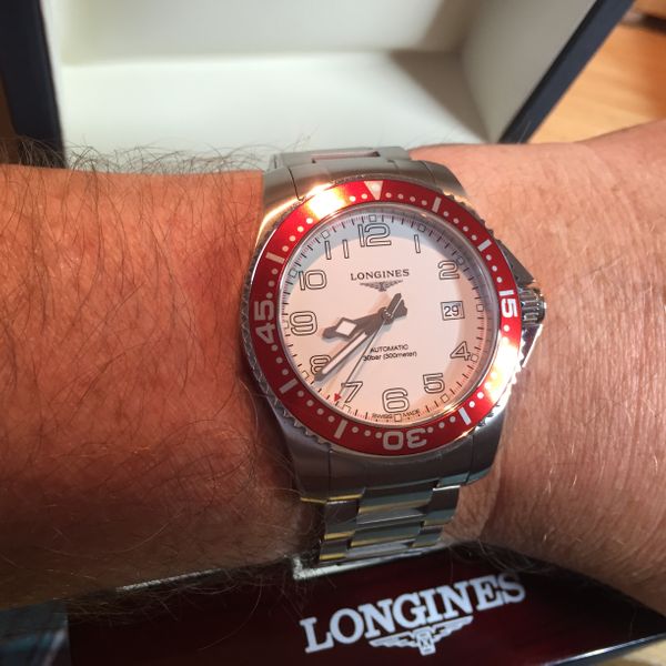 Longines hydroconquest auto white dial red bezel | WatchCharts Marketplace