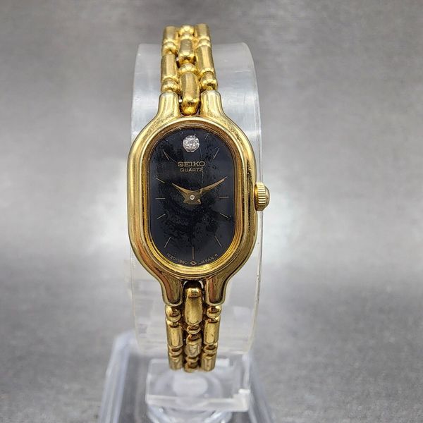 Seiko Watch Women 14mm Black Dial Gold Tone Oval 1E20-6039 New Battery ...