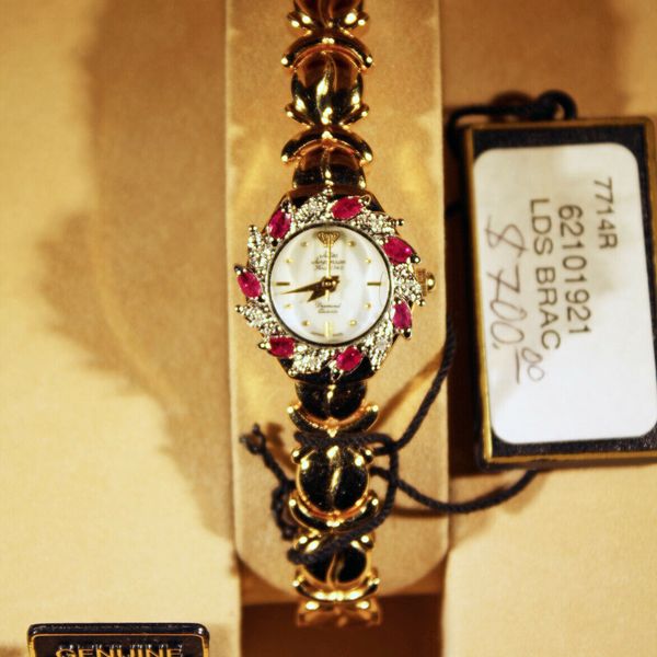 JULES JURGENSEN WOMANS 7 DIAMOND AND 7 RUBY WRISTWATCH WITH ORIGINAL ...