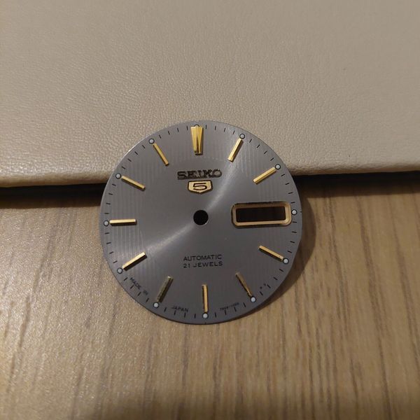 Seiko SNKL19 dial grey sunburst gold indices | WatchCharts Marketplace