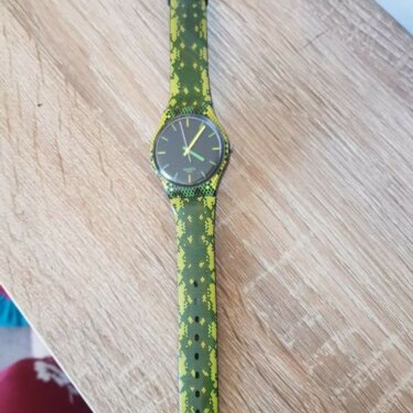 Swatch watch ladies green snake skin effect | WatchCharts