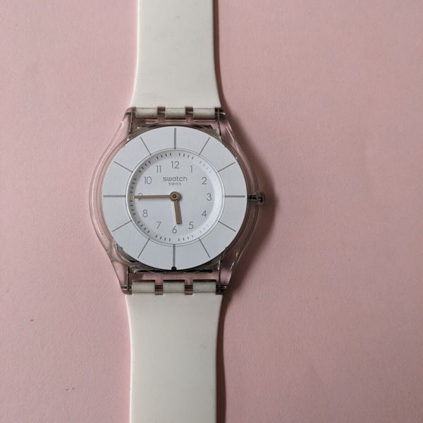 Slim line wrist watch from SWATCH: White strap and white dial ...