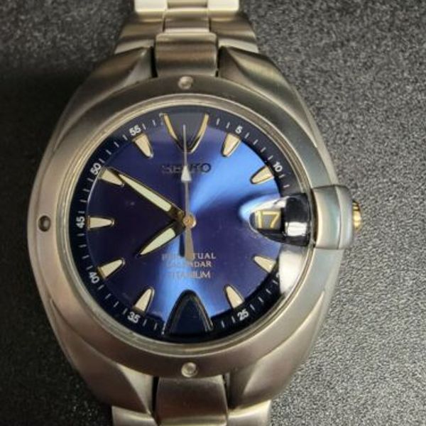 Seiko 8F32-0049 Titanium Blue dial Gold accents HAQ | WatchCharts