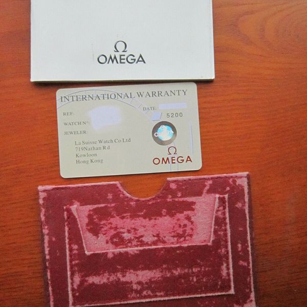 Omega International Warranty card,Operating instructions and well worn ...