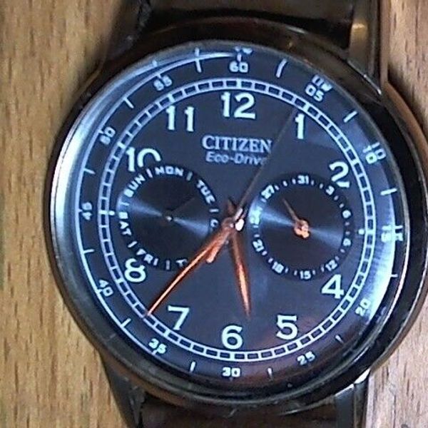 Citizen Eco-Drive solar powered day date watch with black dial and two ...