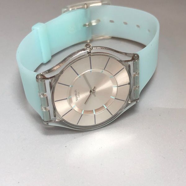 Swatch Skin Ultra Thin Quartz Watch Light Blue Strap Metal Dial New ...