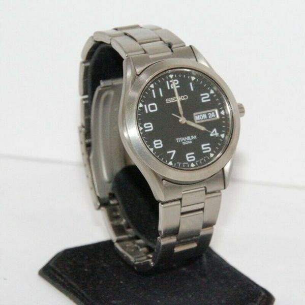 Seiko 7N43-0AB0 Titanium Men's Watch Day & Date | WatchCharts Marketplace