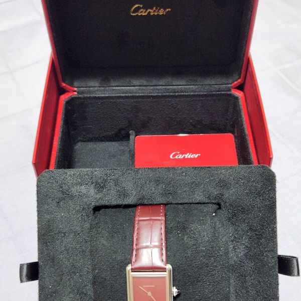 Cartier tank must large red dial wsta0054 | WatchCharts Marketplace
