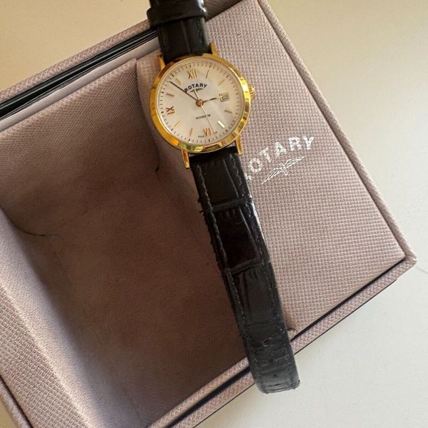 Gold and Black leather Rotary watch needs battery replacement ...