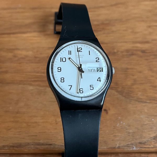 Swatch Watch model #145. Black with white dial. Day/date. Used, fully ...