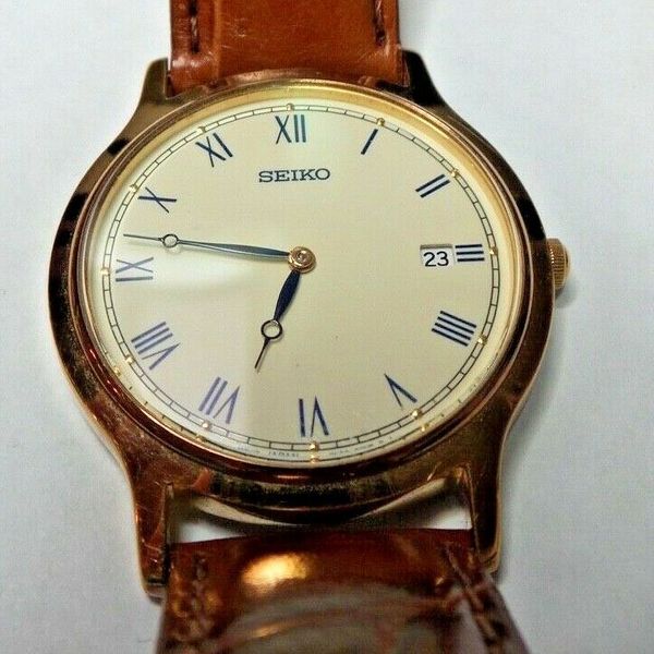 VINTAGE SEIKO MEN'S GOLD TONE WATCH WITH BROWN LEATHER BAND 7N39 Mint B | WatchCharts