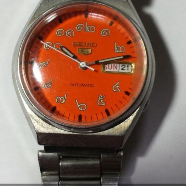 Sold Fun affordable Seiko 5. Orange dial with Thai numerals | WatchCharts
